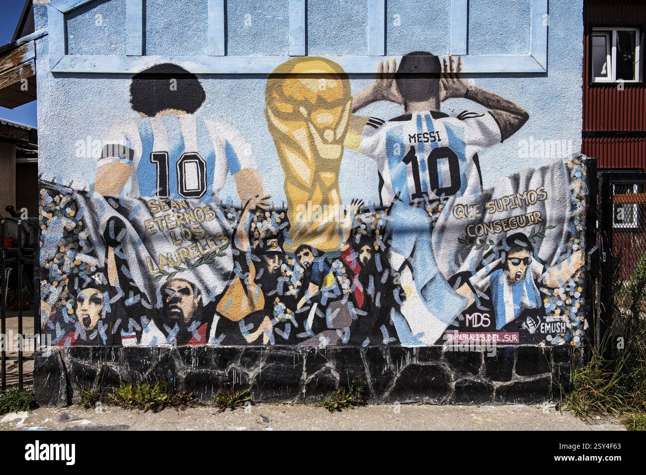 Diego Maradonna and Lionel Messi with the World Cup trophy on a house ...