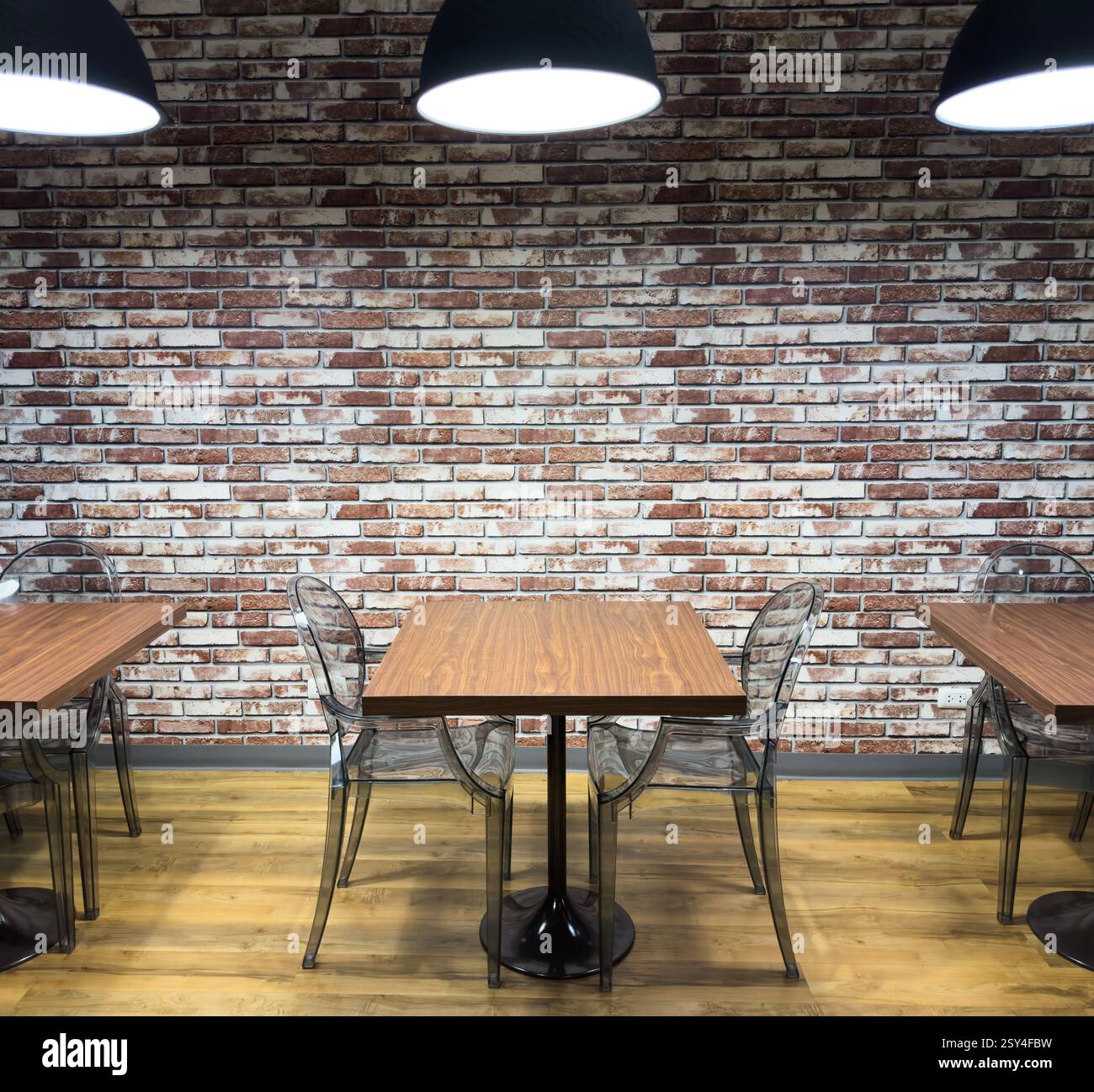Inviting space with wooden tables and clear chairs in a modern library ...