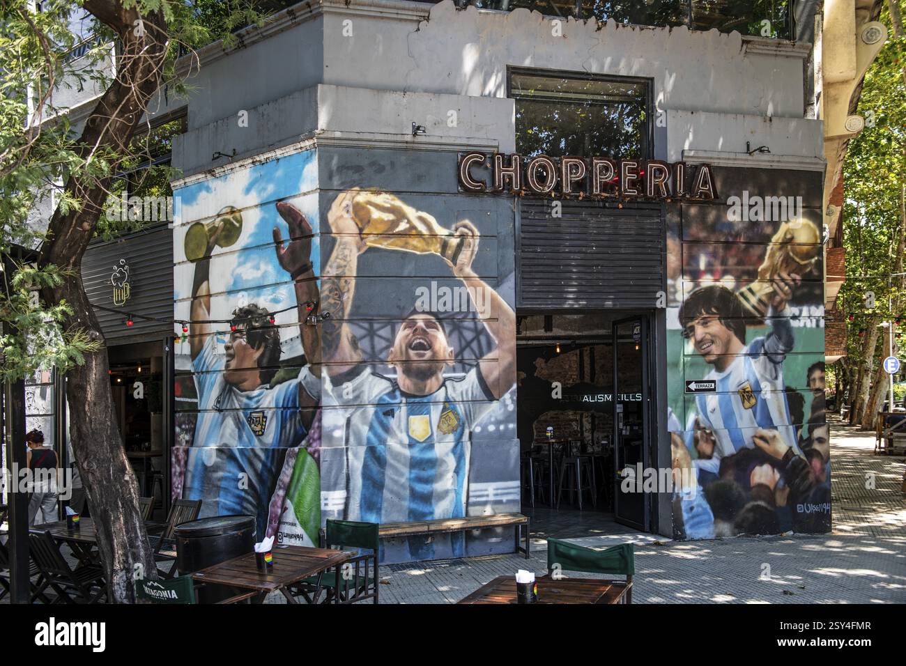 Lionel Messi with World Cup trophy on the wall of a house at El ...