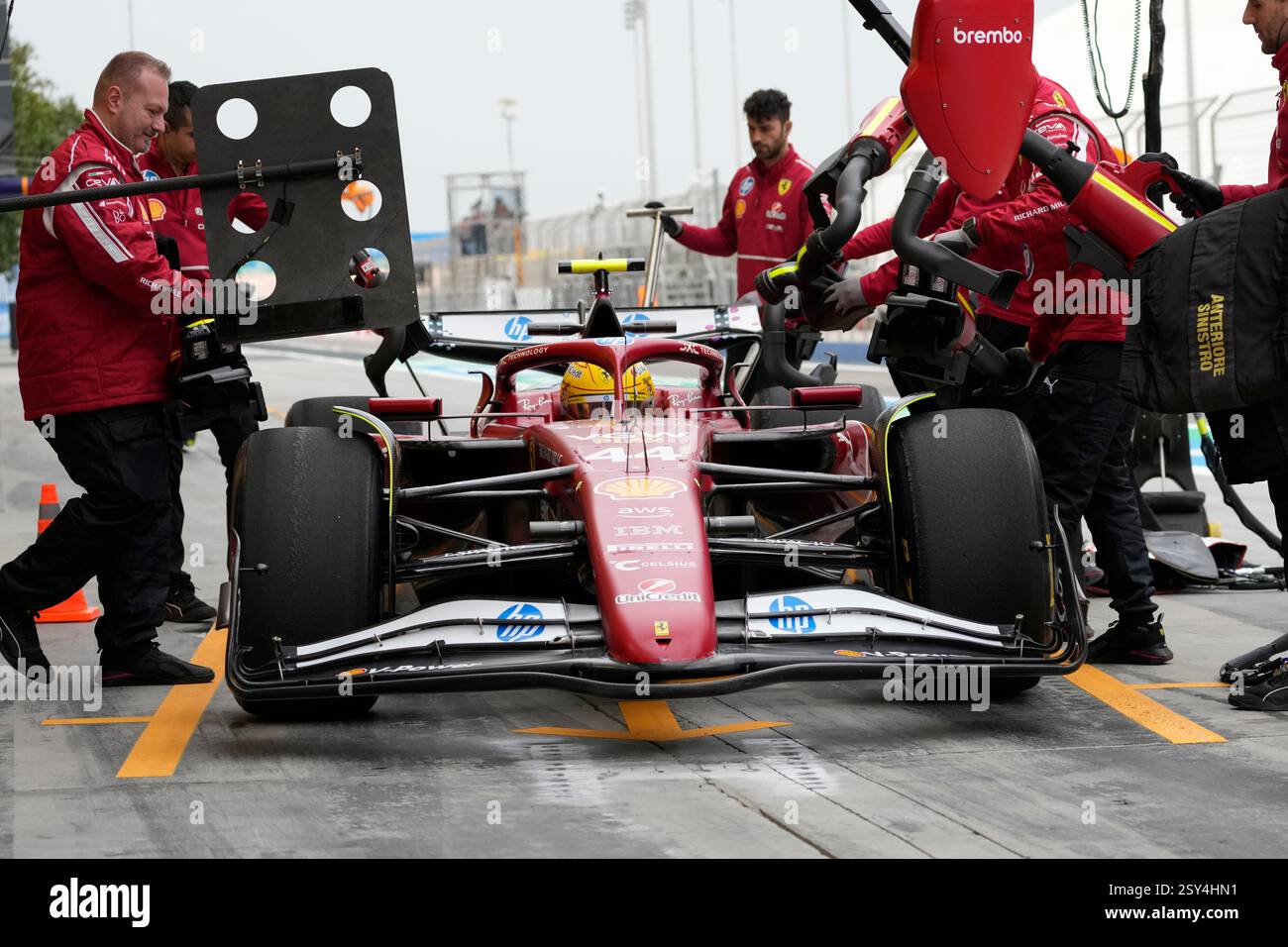 Ferrari driver Lewis Hamilton of Britain makes a pit stop during a ...