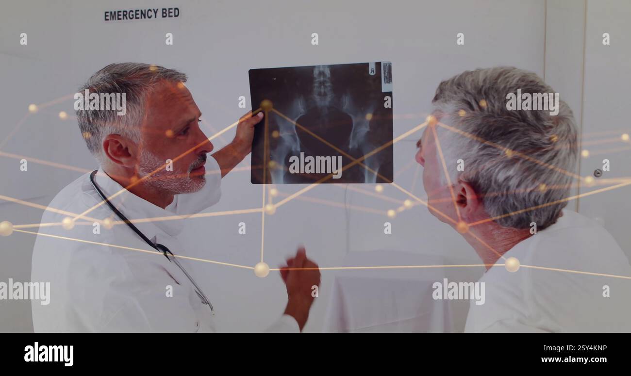 Image of network of connections over caucasian male doctors reading x ...