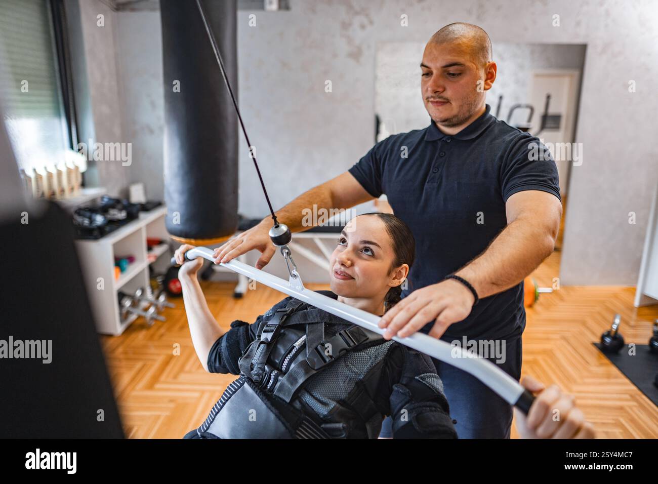Training session with muscle stimulation equipment in gym Stock Photo ...