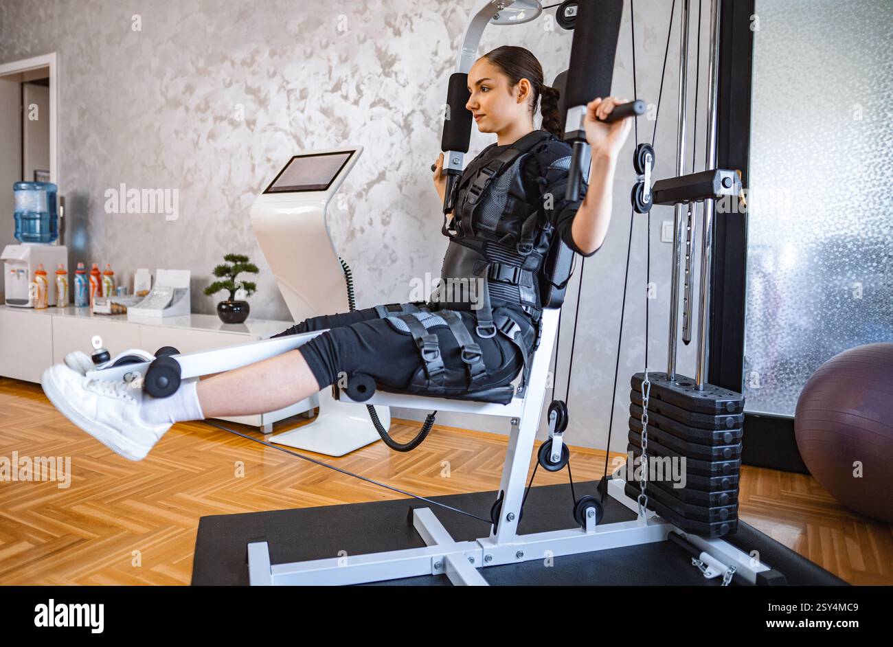 Full-body workout with electrical stimulation Stock Photo - Alamy