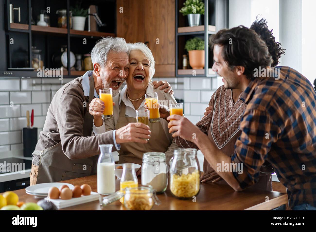 Multi generation multiethnic family having fun, talking around a ...