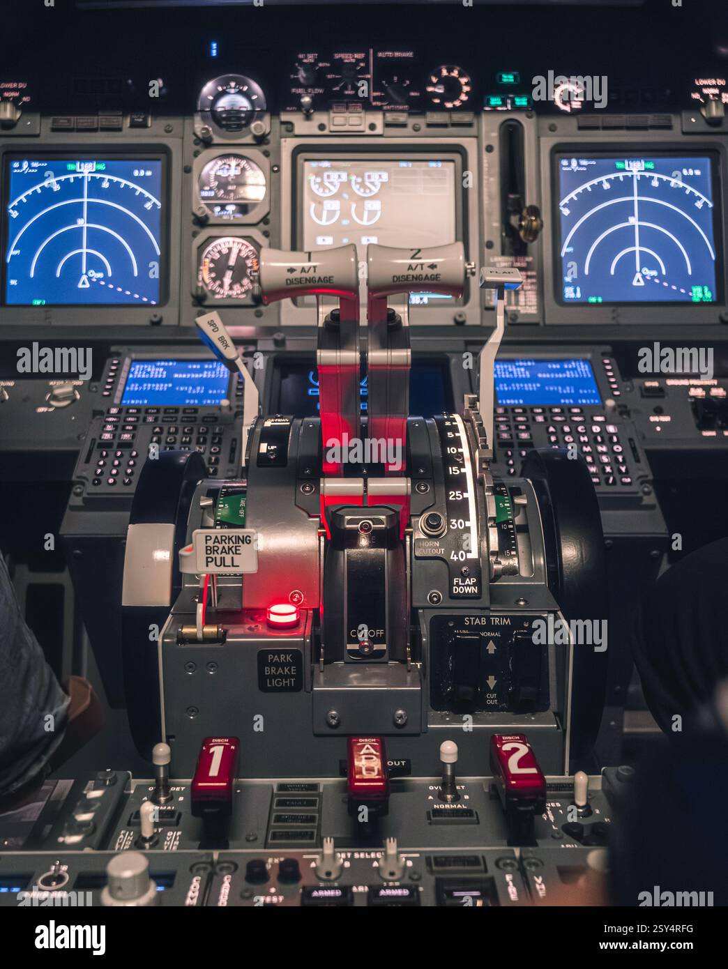 Cockpit view of an airplane during a night-time flight with illuminated ...