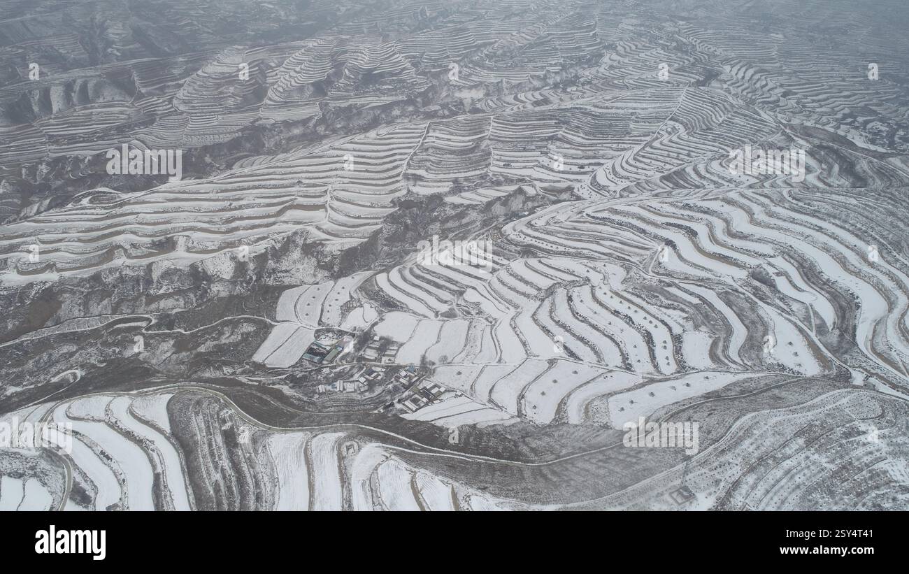 Aerial photo shows the snow-covered terraced fields in Dingxi City ...