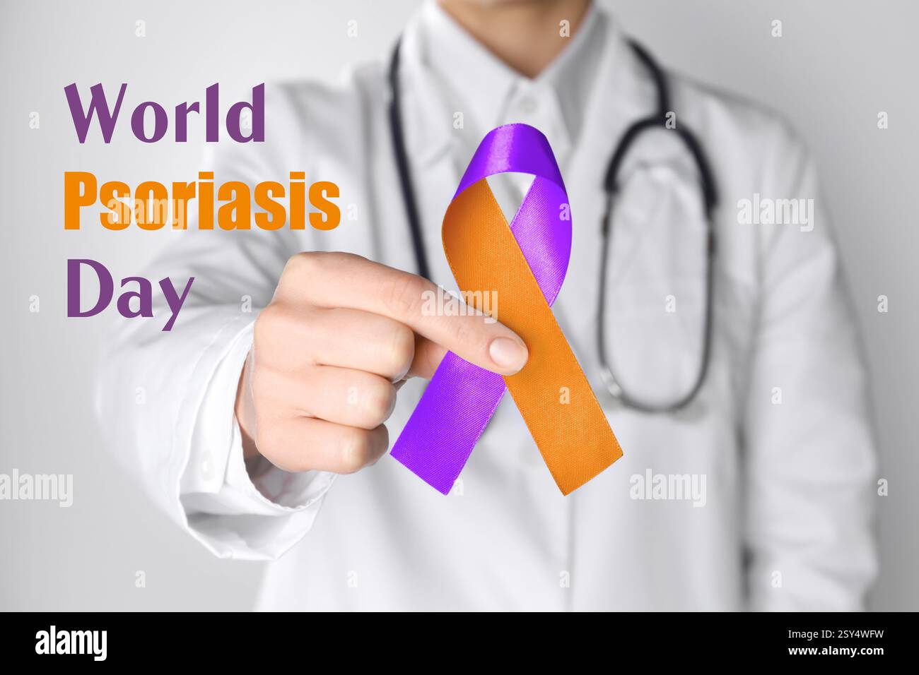 World Psoriasis Day. Doctor holding orange-orchid awareness ribbon on ...