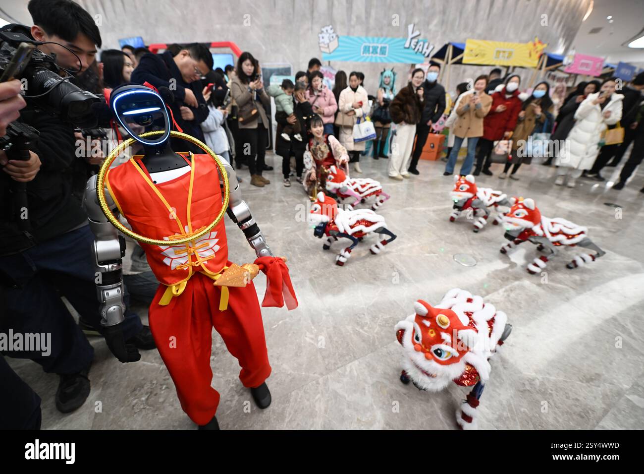 Hangzhou,China.26th February 2025. Robot dogs dressed as lion dancers ...
