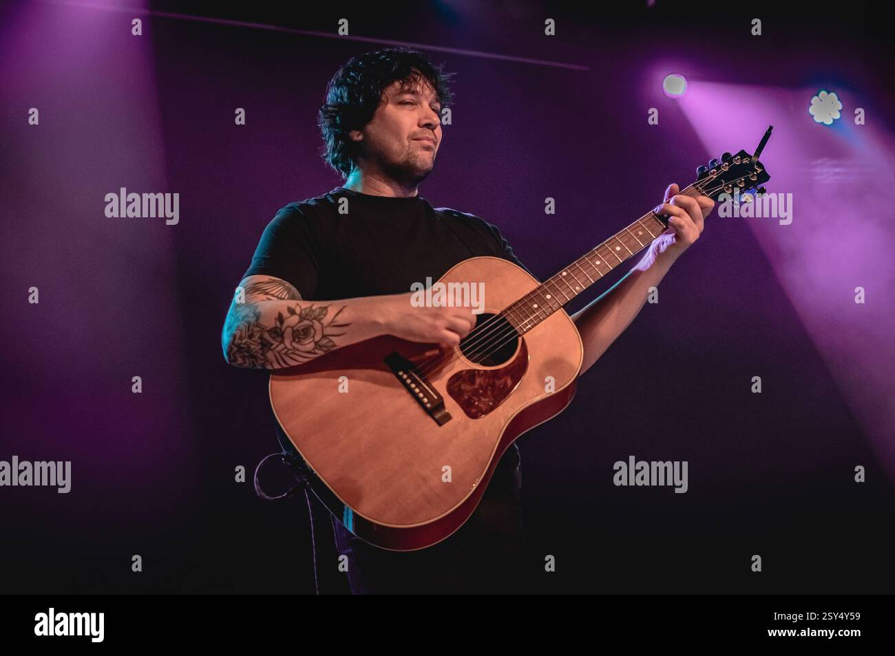 Rome, Italy. 25th Feb, 2025. Chris Haddon play the guitar during Tom ...