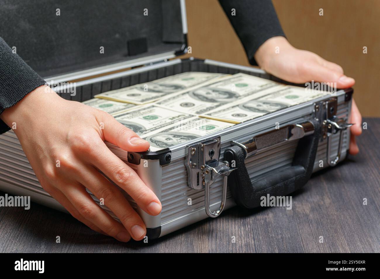 Closeup view of female hands holding money case with cash Stock Photo ...