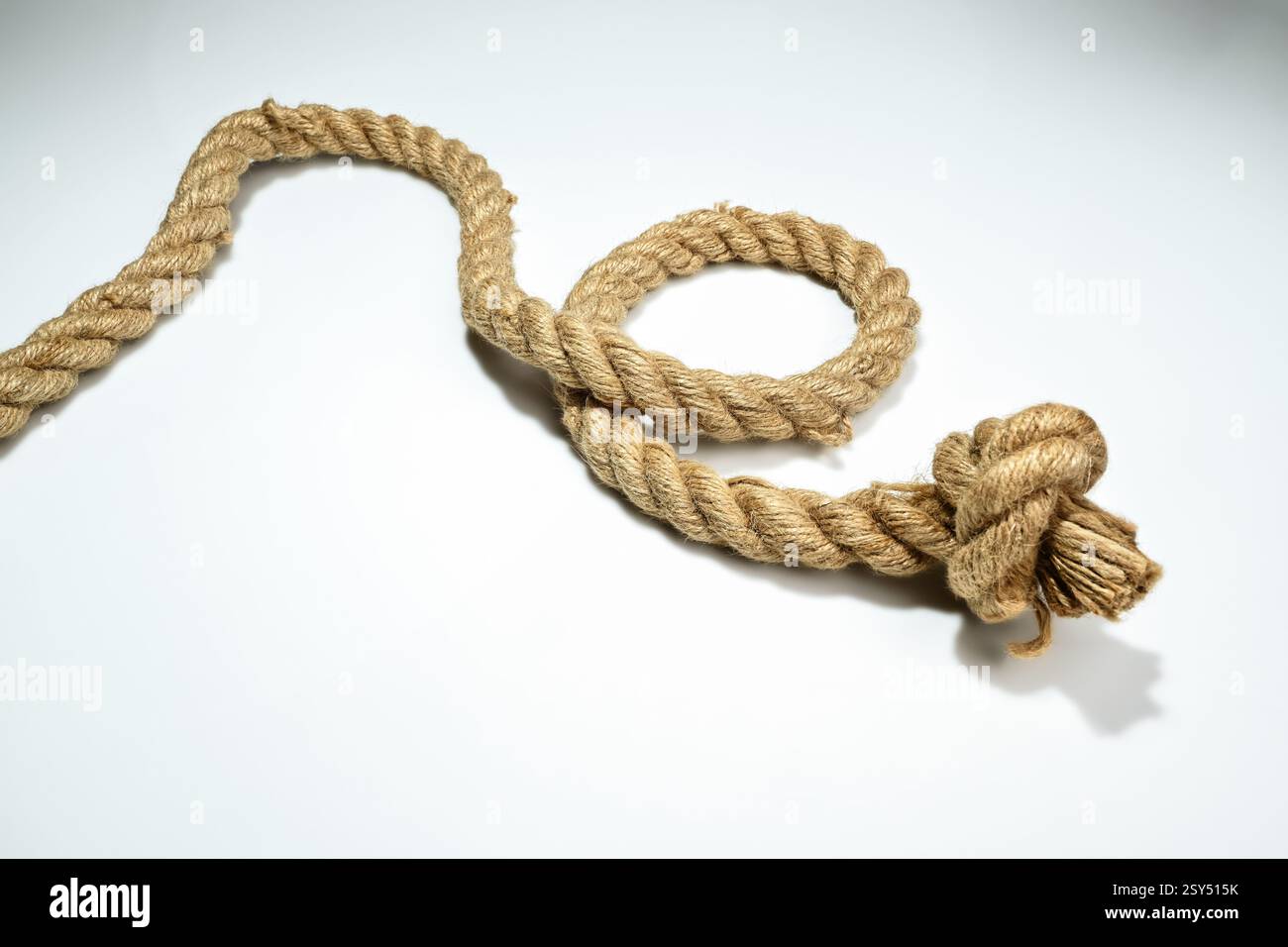 Closeup view of ropes string with a knot isolated over a white ...