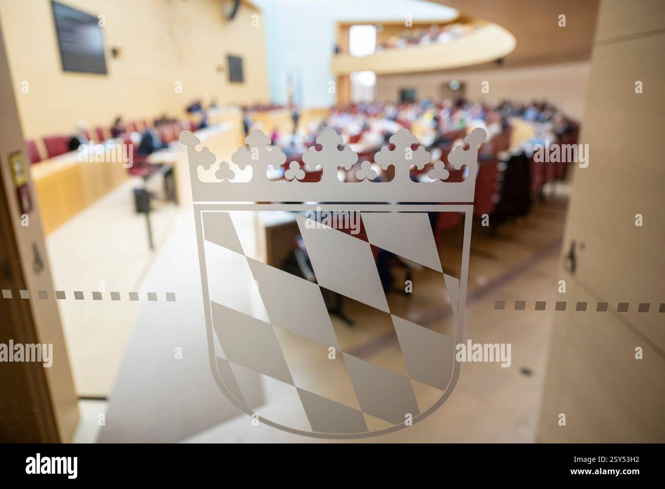 27 February 2025, Bavaria, Munich: The Bavarian coat of arms is stuck ...