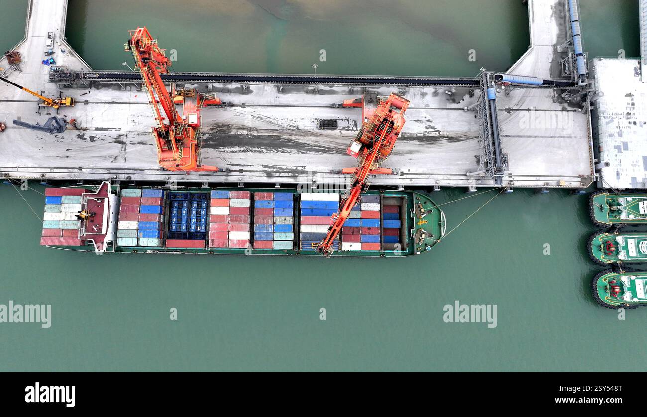 NINGDE, CHINA - FEBRUARY 27, 2025 - Cargo ships load and unload new ...