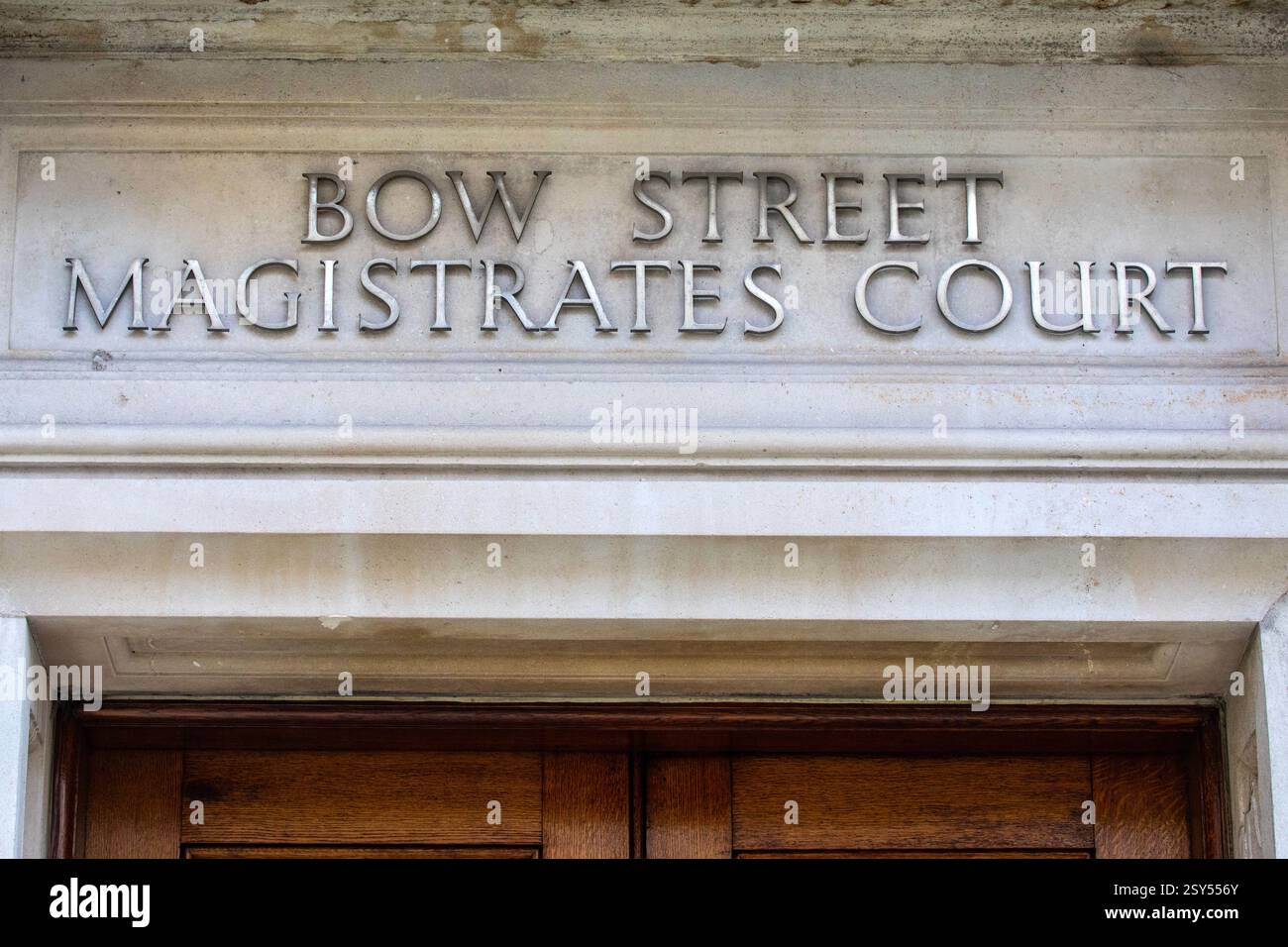Sign above the entrance to the historic Bow Street Magistrates Court ...