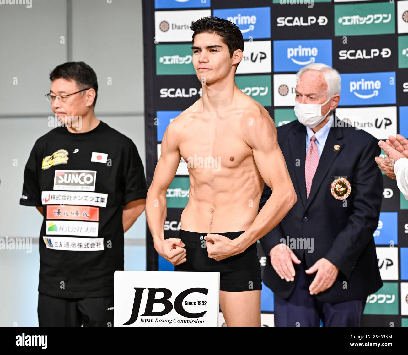 Challenger Mexico's David Cuellar poses on the scale during the official weigh-in for his WBC ...