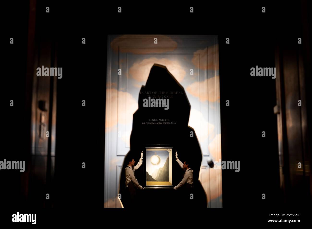 Gallery assistants with the piece 'La reconnaissance infinie' by Rene ...