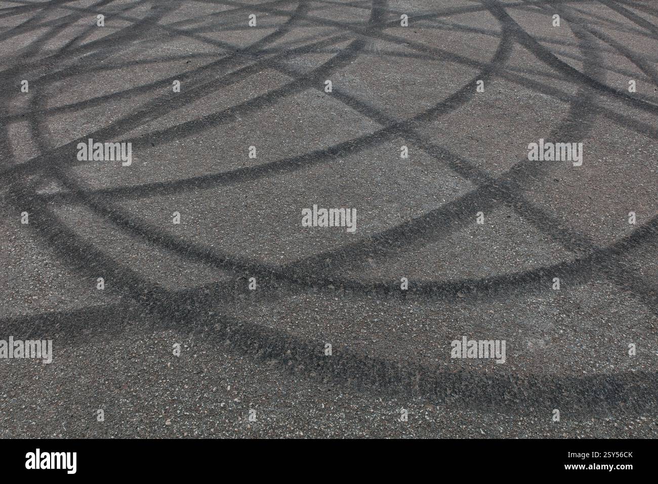 Closeup of burned rubber tire tracks on asphalt Stock Photo - Alamy