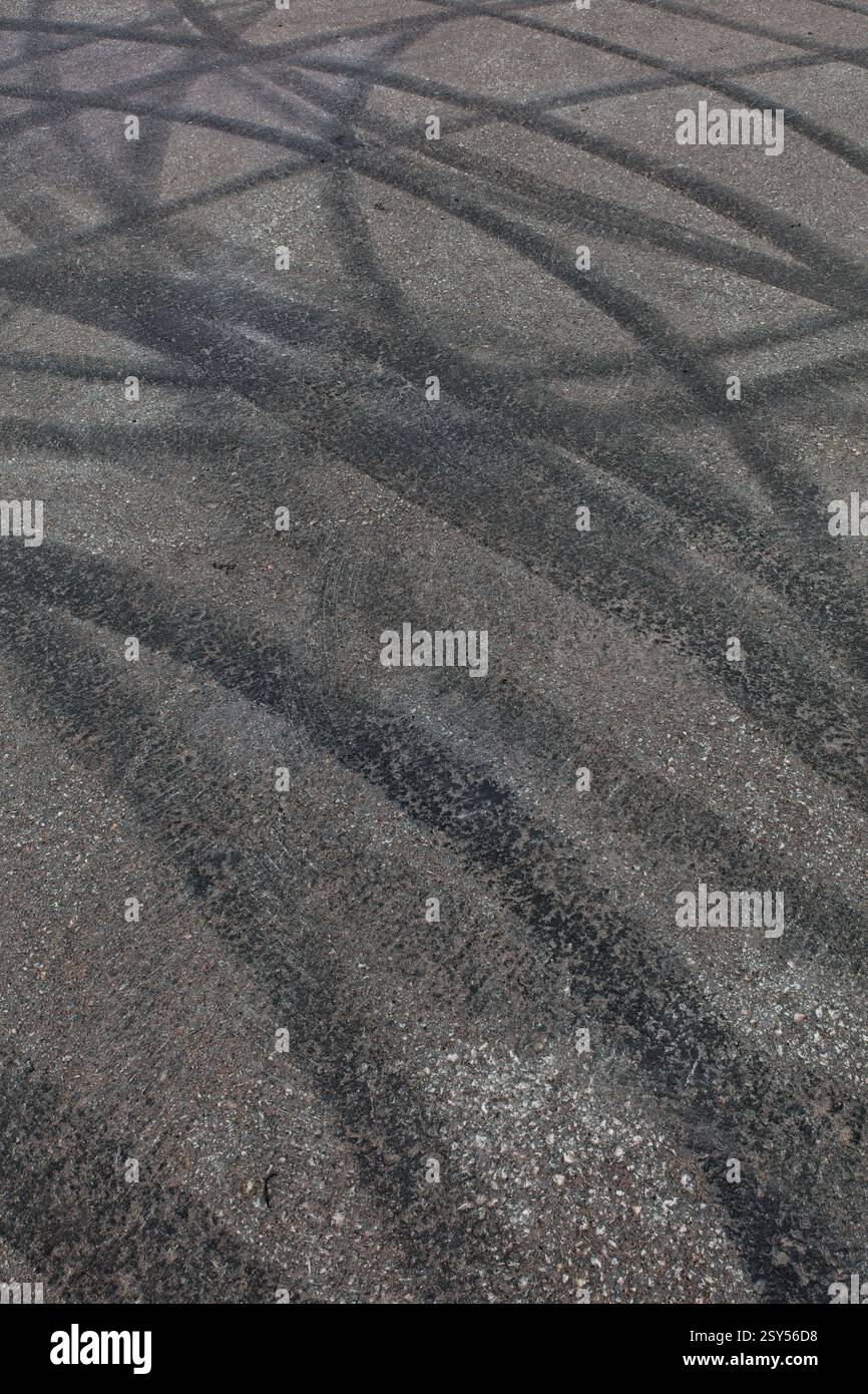 Closeup of burned rubber tire tracks on asphalt Stock Photo - Alamy