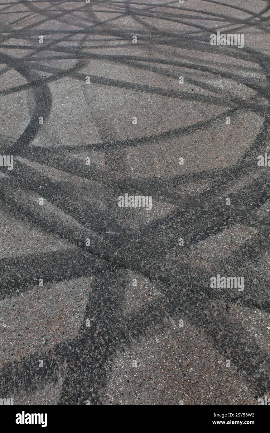 Closeup of burned rubber tire tracks on asphalt Stock Photo - Alamy
