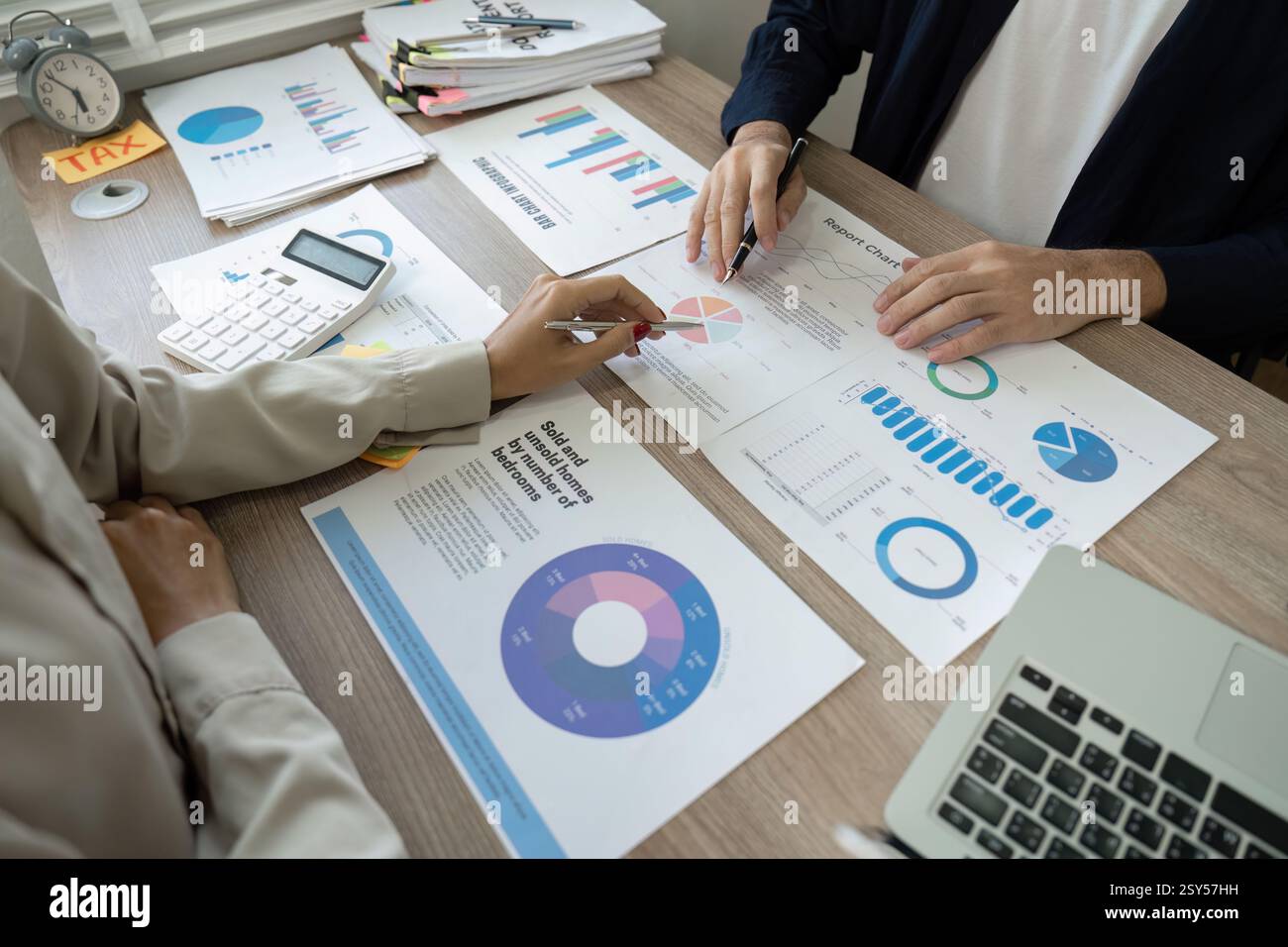 Collaborative financial analysis charts hi-res stock photography and ...