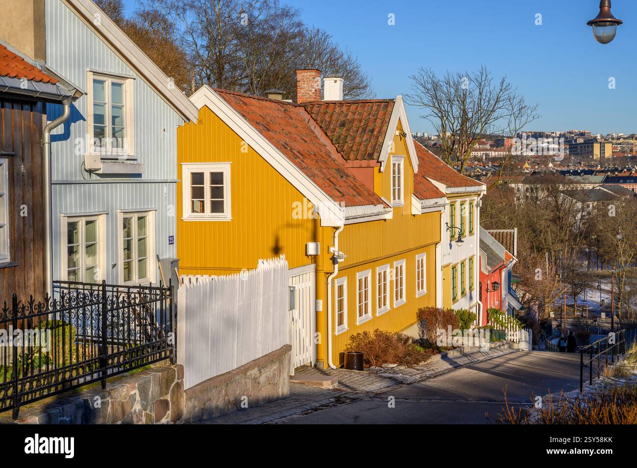 Telthusbakken is a hilly road with well-preserved and inhabited wooden ...