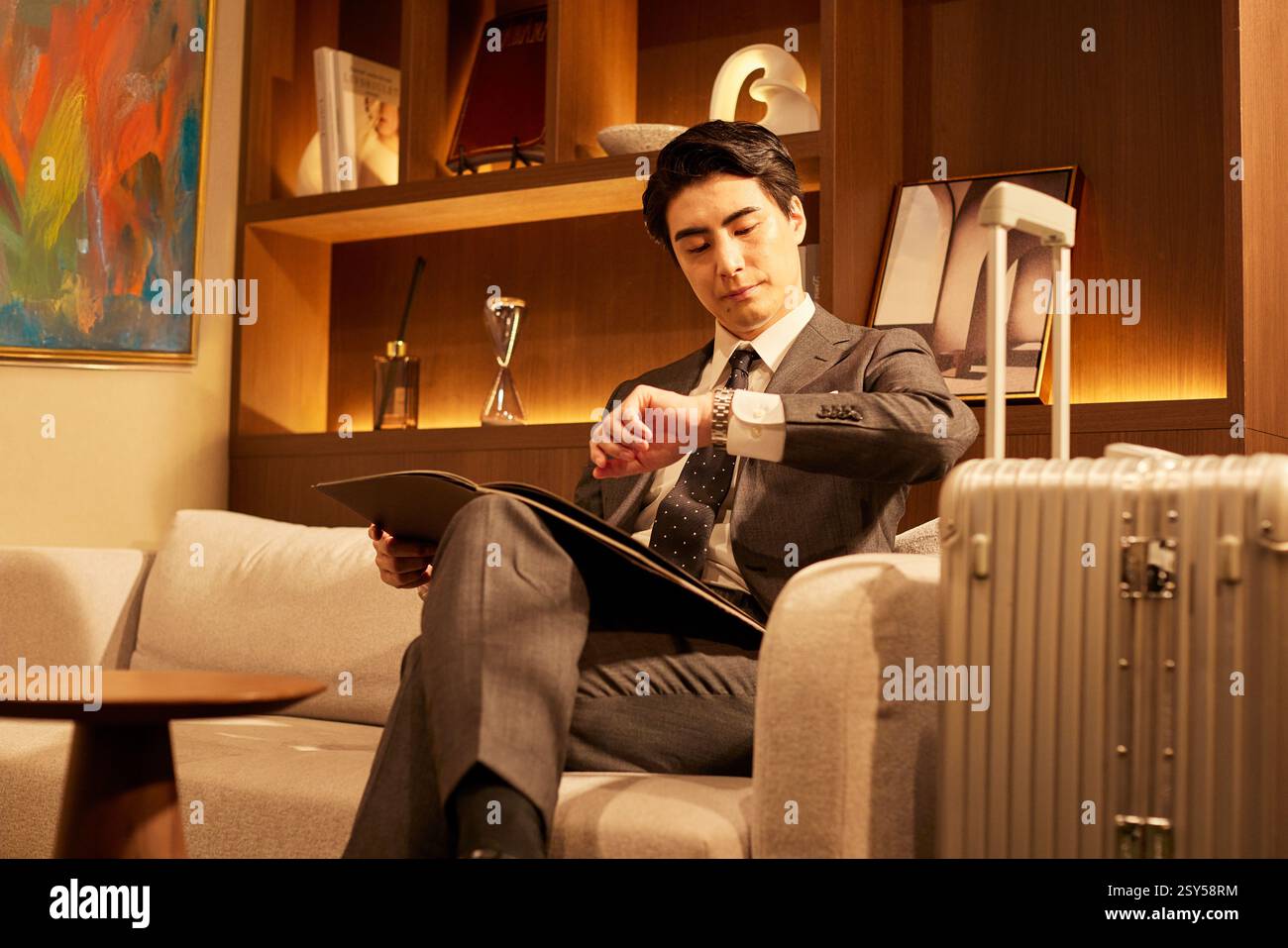Japanese Man Sitting On A Couch Stock Photo - Alamy