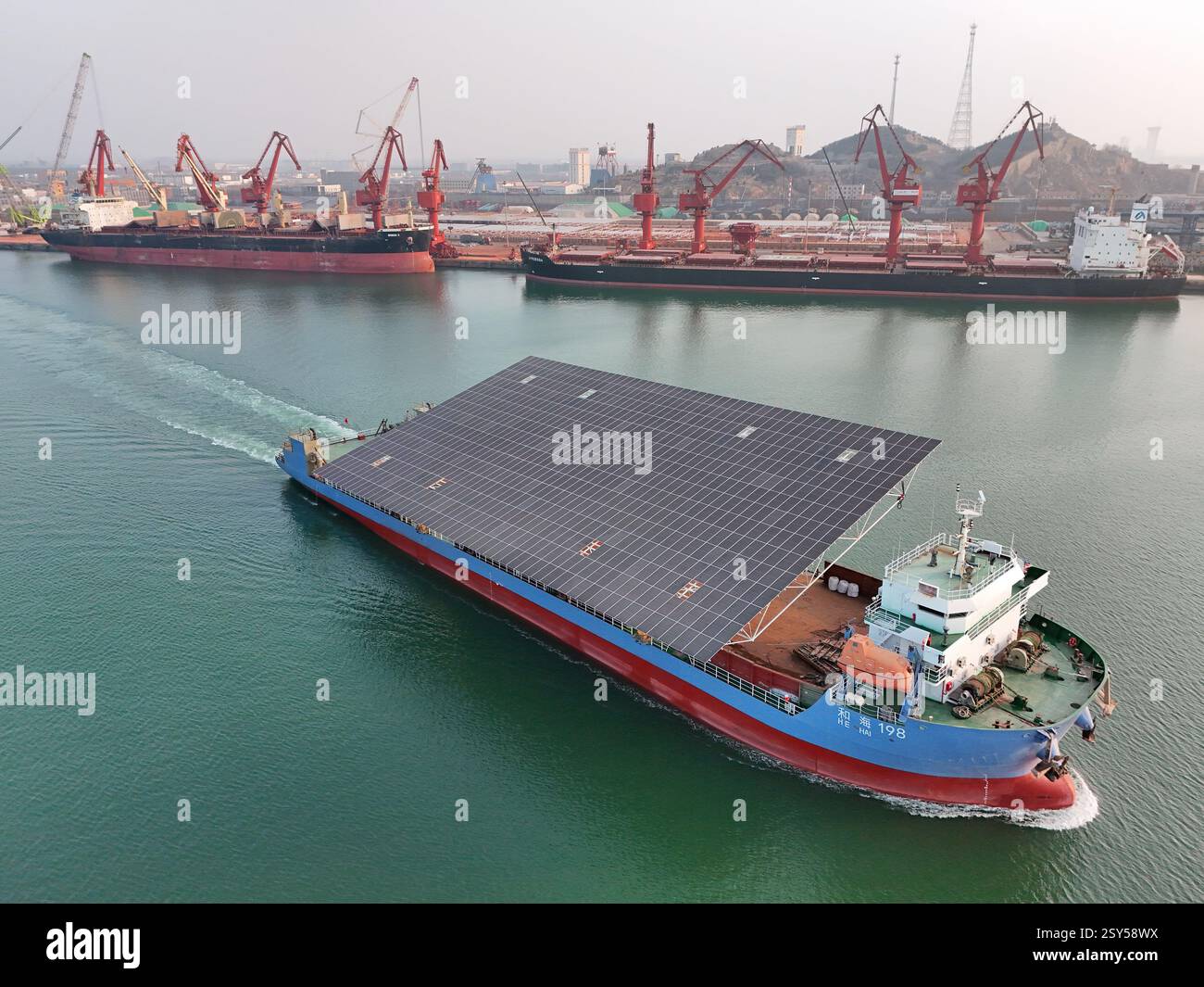YANTAI, CHINA - FEBRUARY 27, 2025 - A cargo ship carrying a large steel ...