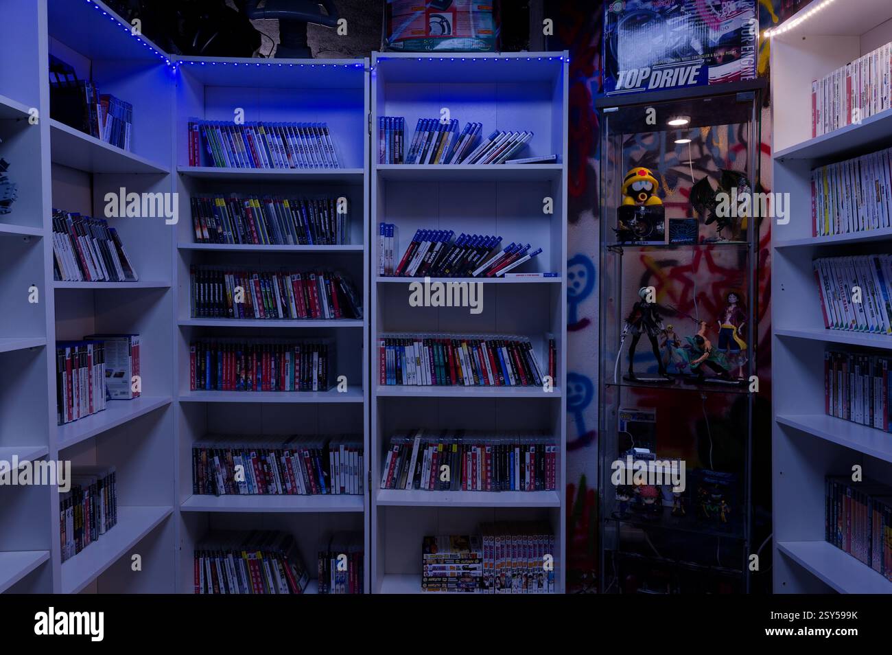 Shelves filled with video games, DVDs, and collectibles inside a retro video game store Stock ...