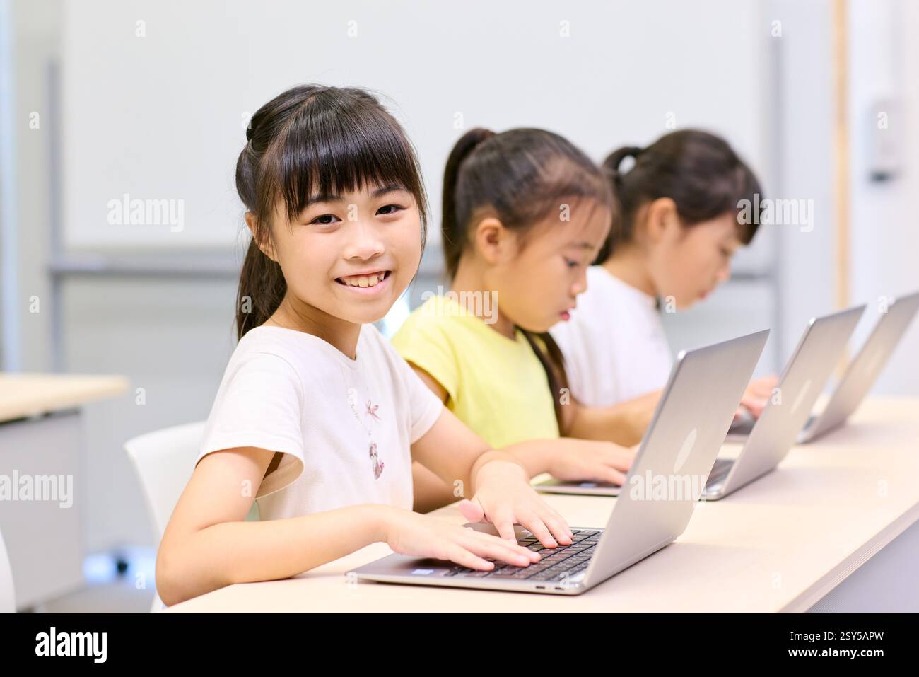 Japanese Children Using Laptops In Classroom Stock Photo - Alamy