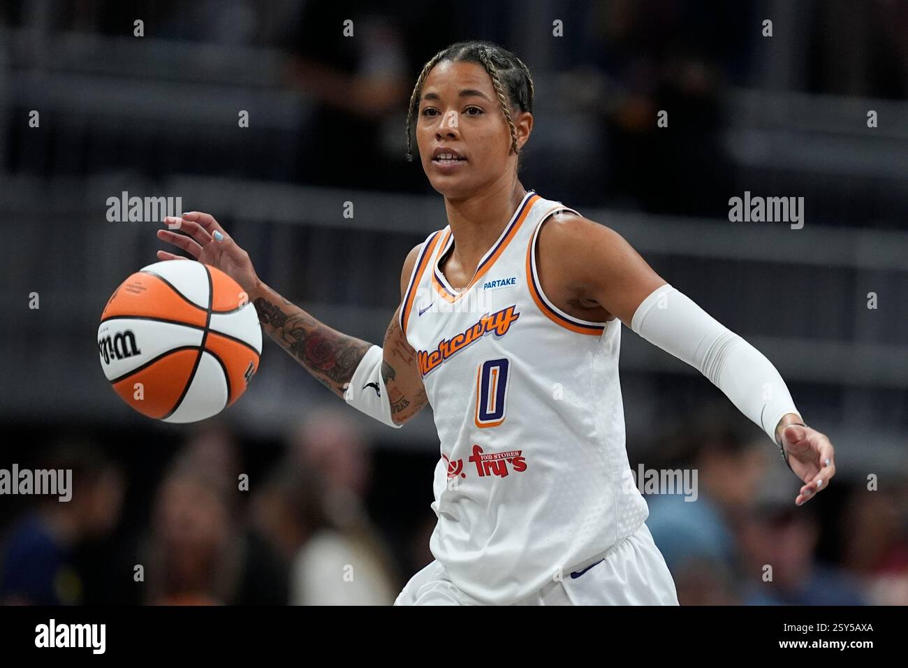 FILE - Phoenix Mercury's Natasha Cloud dribbles during the first half ...