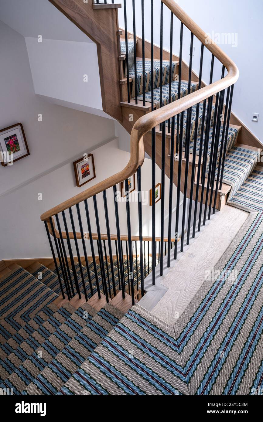 Striped carpet runner on staircase in contemporary redesign of West ...
