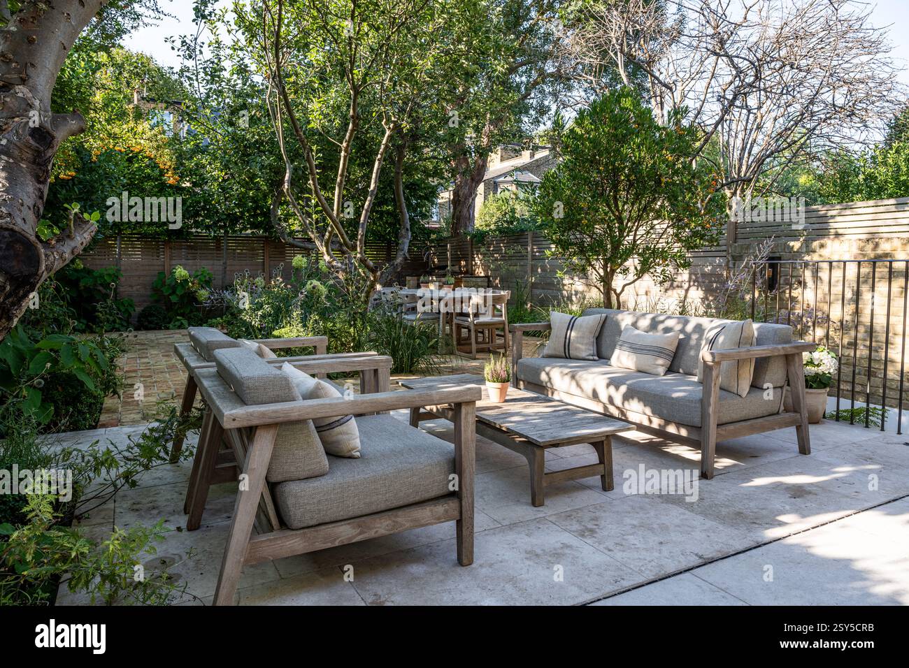 Paved garden terrace and seating for low maintenance contemporary ...