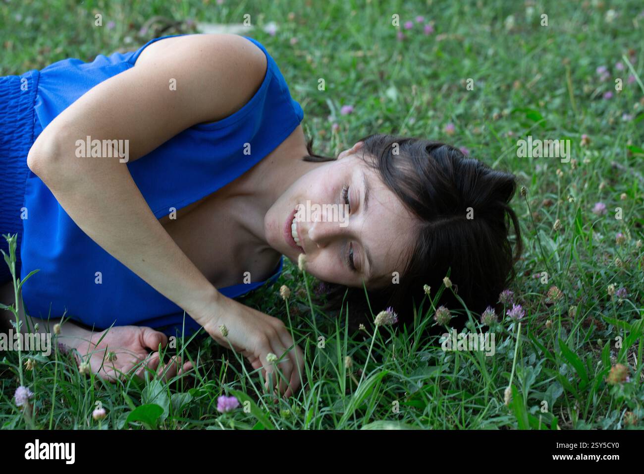 Woman in blue dress outdoors hi-res stock photography and images - Alamy