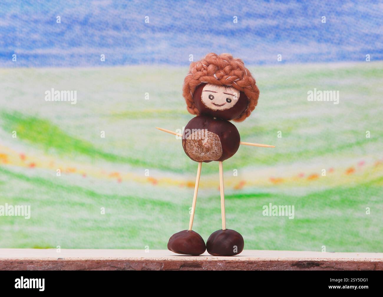 cute male chestnut figure with crocheted cap standing in front of a ...