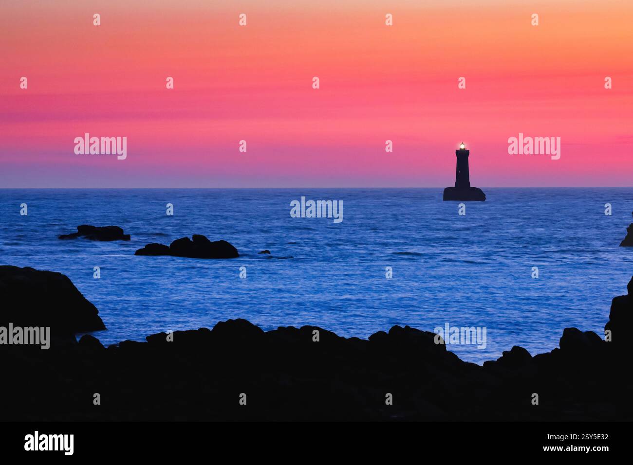 Phare du Chenal du Four lighthouse at sunset, France, Brittany ...