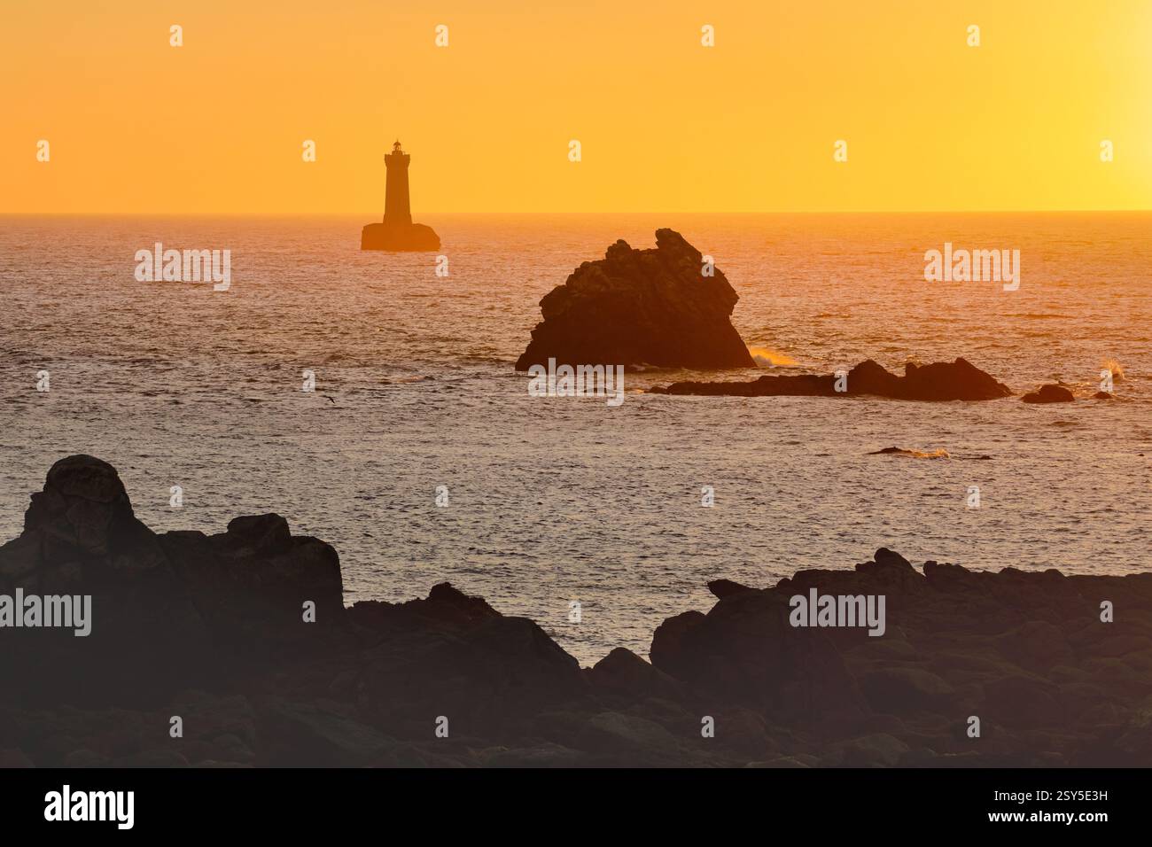 Phare du Chenal du Four lighthouse at sunset, France, Brittany ...
