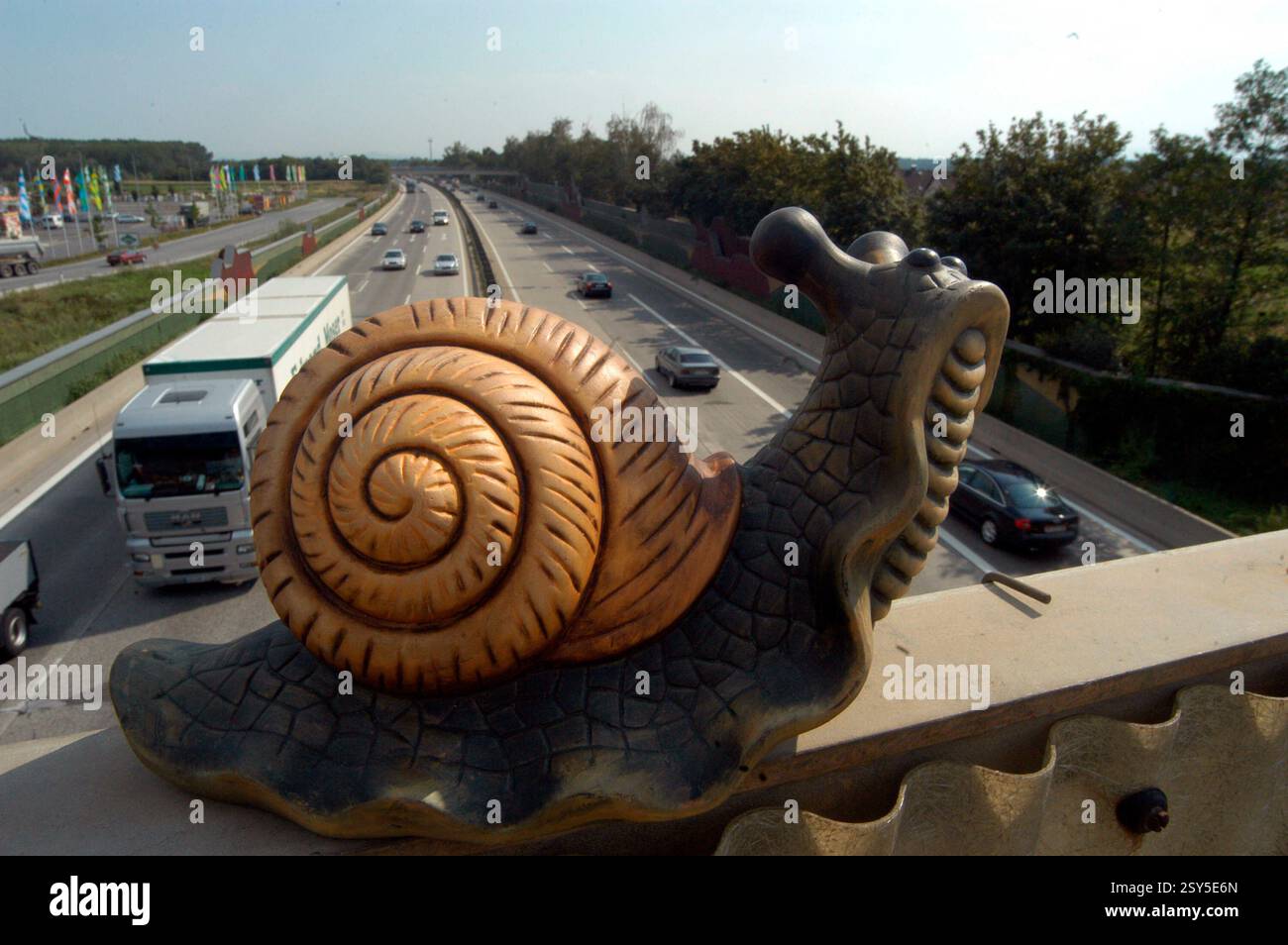 driving with snail pace on the highway, speed limit on the road snail ...