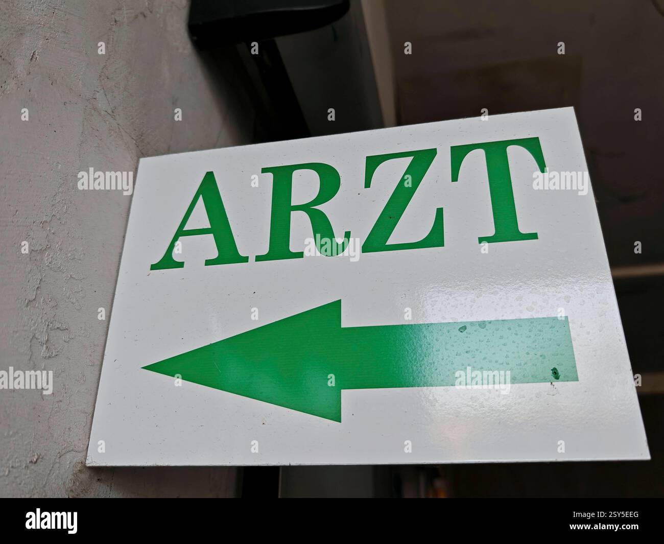 man wearing a black shirt with a DOC sign on it, white background ...