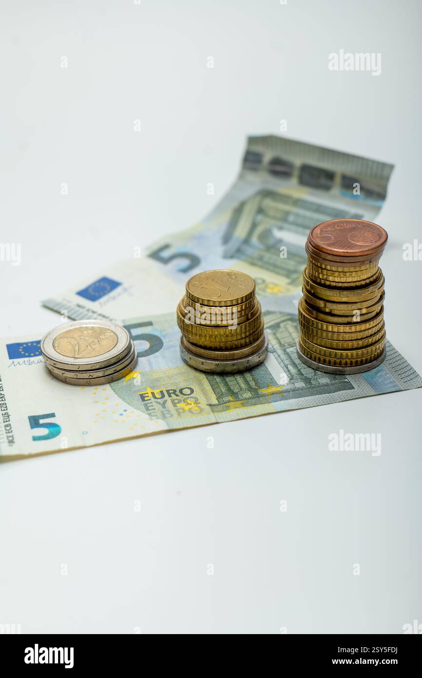 5 euro banknotes and coins isolated on white background Stock Photo - Alamy