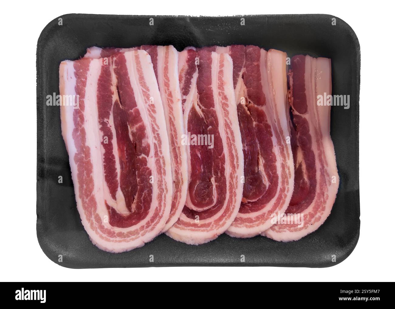 Fresh pork belly for grilling, bacon slices packaged in black plastic ...