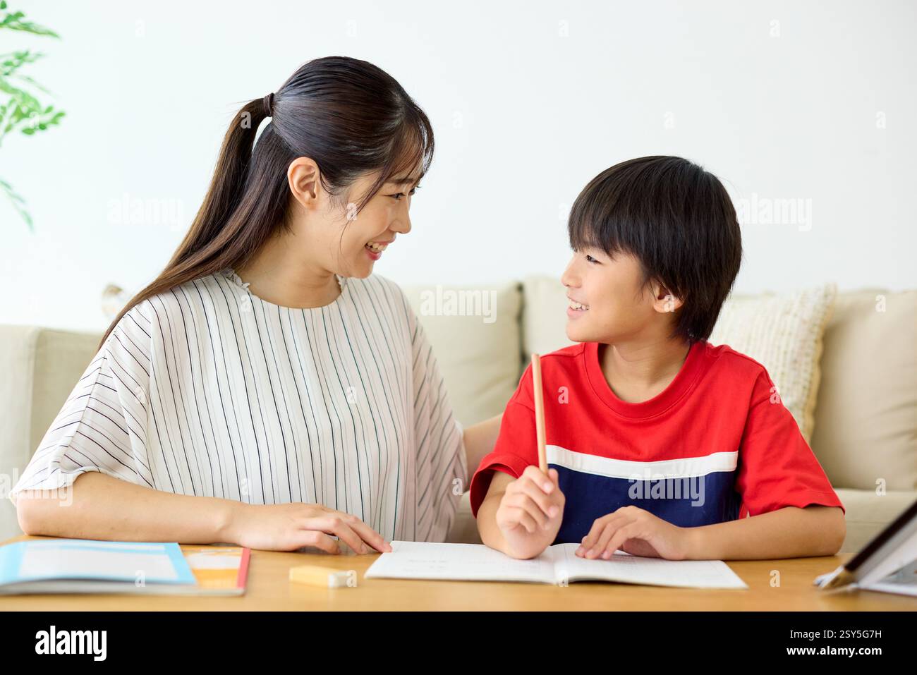 Japanese Mother And Son Doing Homework At Home Stock Photo - Alamy