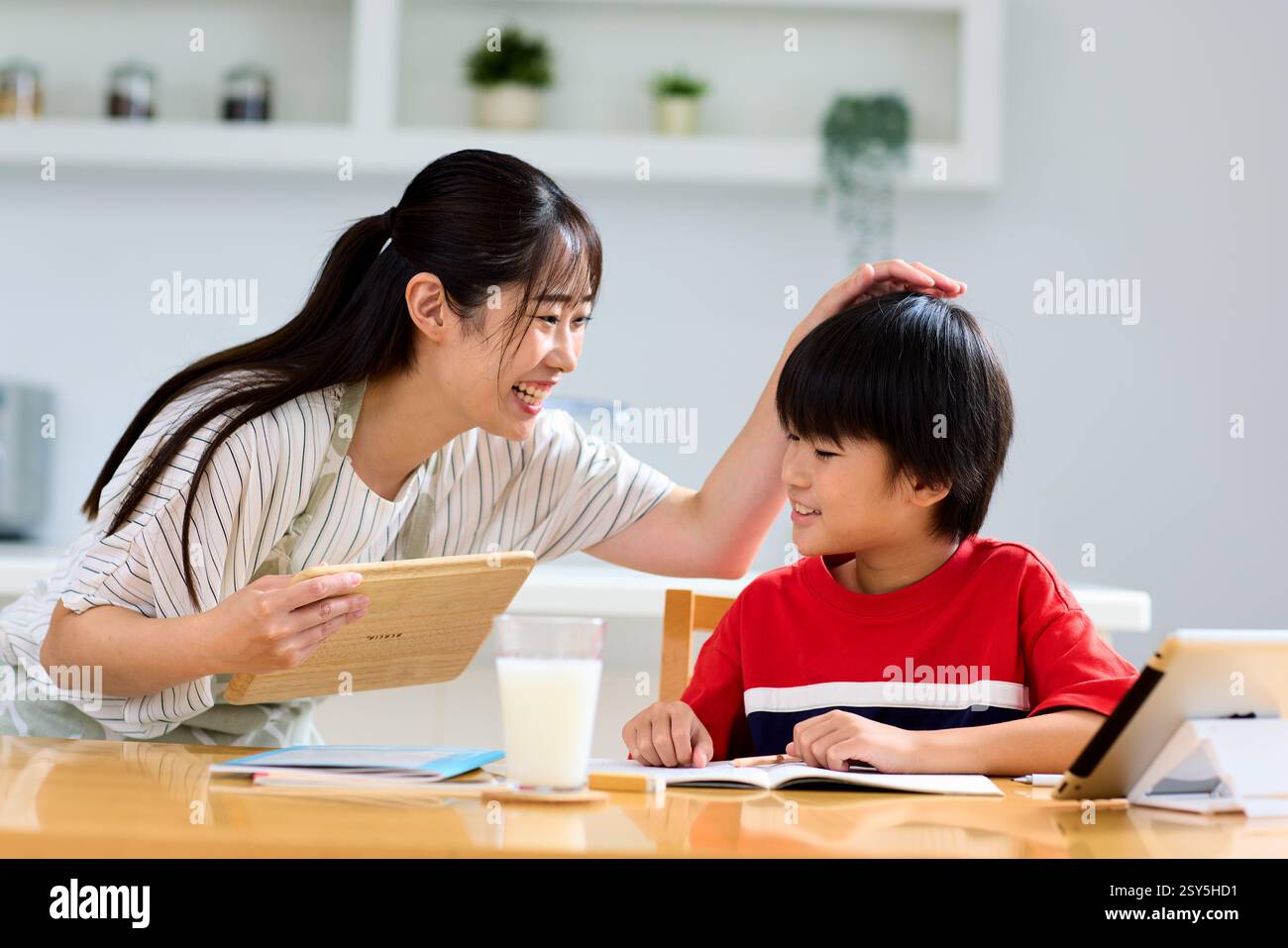 Japanese Mother And Son Working On Homework Stock Photo - Alamy