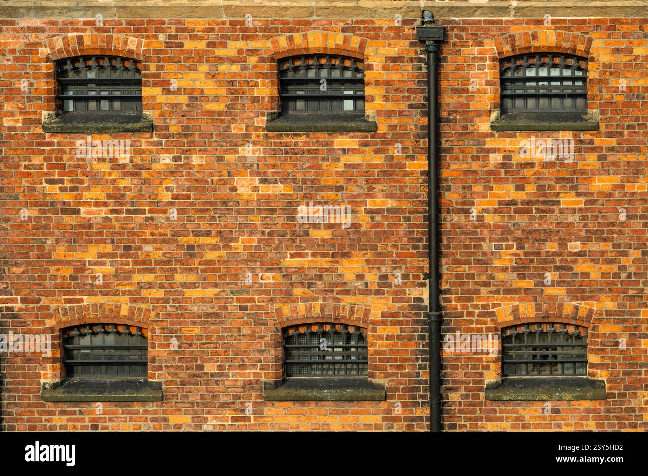 Cell windows with bars, exterior of Victorian jail museum, Lincoln ...