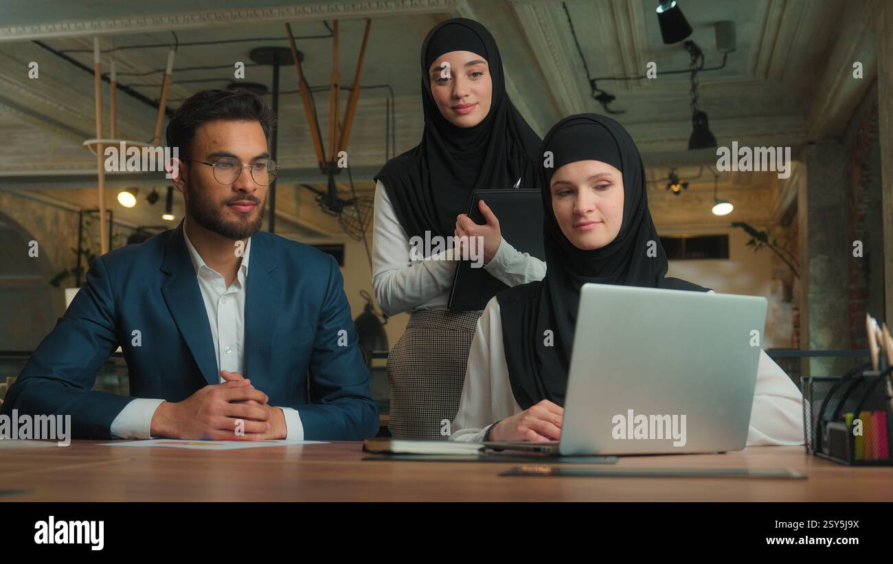 Friendly business team office colleagues employees Arabian man muslim ...