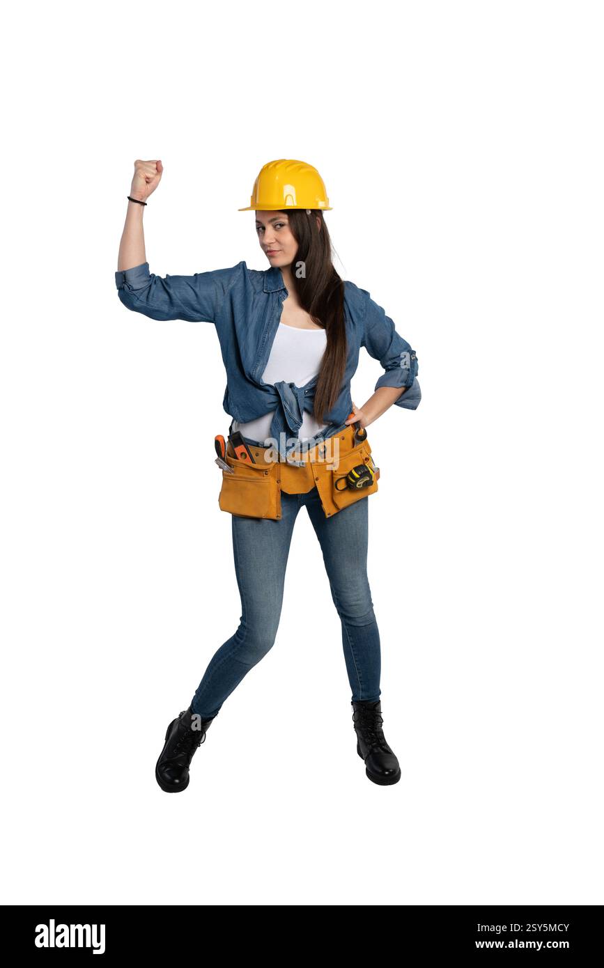 A strong and confident female construction worker wearing a yellow safety helmet, denim shirt ...