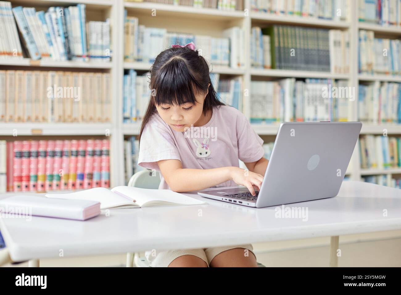 Japanese Kid In School Library Stock Photo - Alamy
