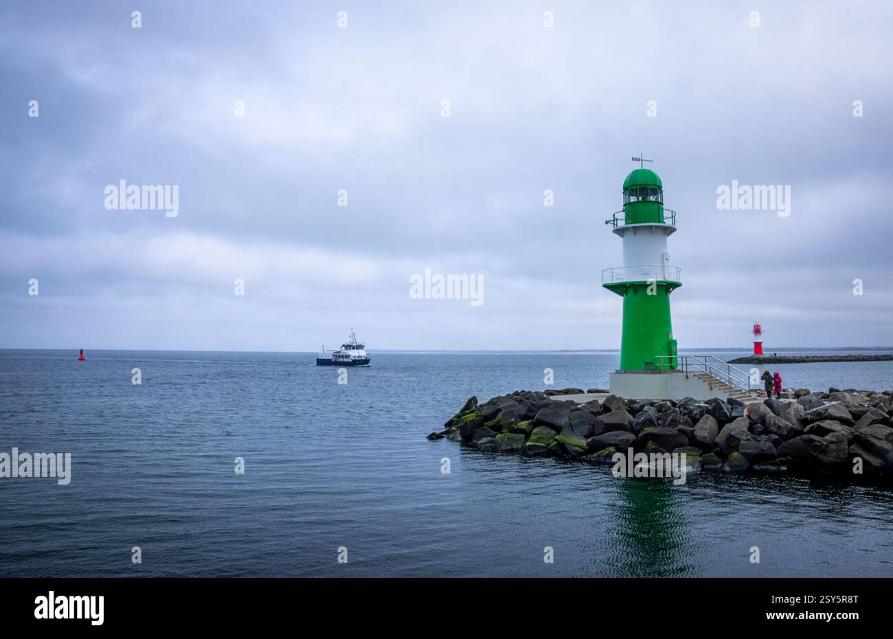Rostock, Germany. 27th Feb, 2025. An excursion boat sails into the ...