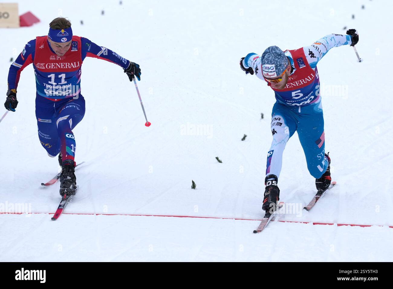 Remi Bourdin of France, left, and Ben Ogden of the United States cross ...