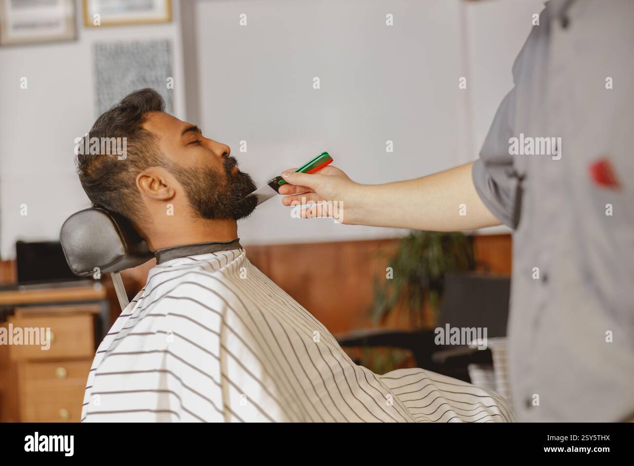 A Professional Barber Offering an Exceptional Grooming Experience for ...