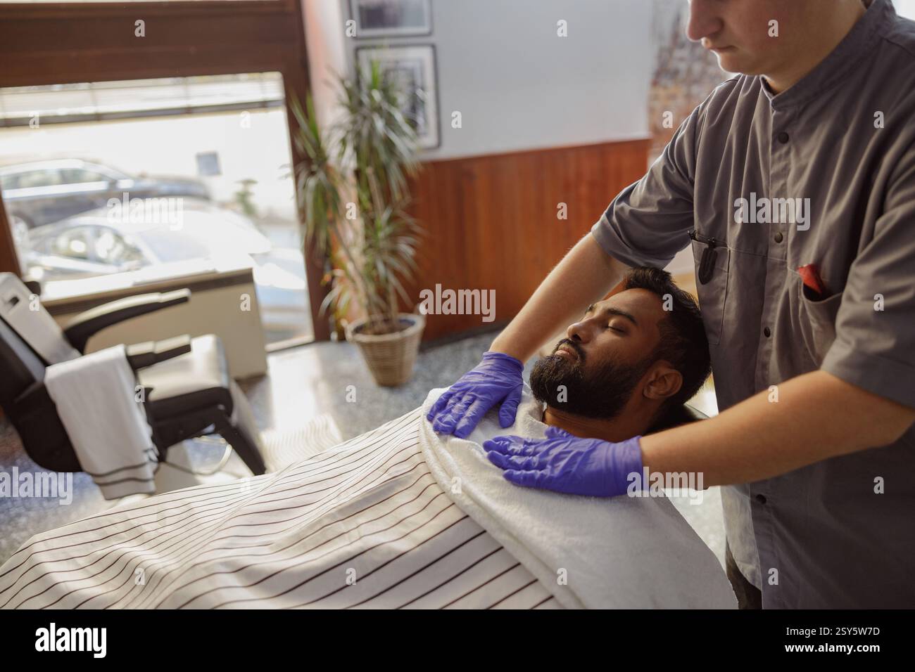 Enjoy a body and soul relaxing barber treatment session in a modern ...